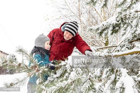 50 Year Old White Male With His 5 Year Old Son On A Winter Walk High