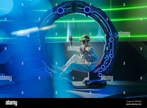 Woman Wearing Virtual Reality Simulators Sitting In Futuristic Circle