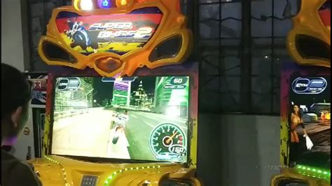 슈퍼 바이크 2 동전 작동 모터 아케이드 비디오 자동차 레이싱 게임기 Sal을위한 실내 놀이 경주 자동차 시뮬레이터 게임기 Buy Ff 모터모터 레이싱 게임 기계