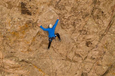 Man Climber Rock Climbing Cliffs In Tamgaly Tas Kazakhstan Stock