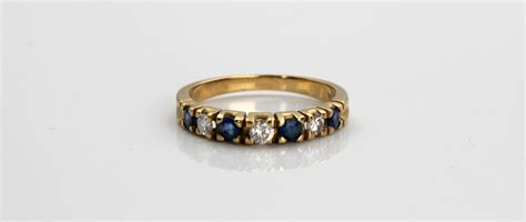Lot An 18ct Yellow Gold Diamond And Sapphire Ring
