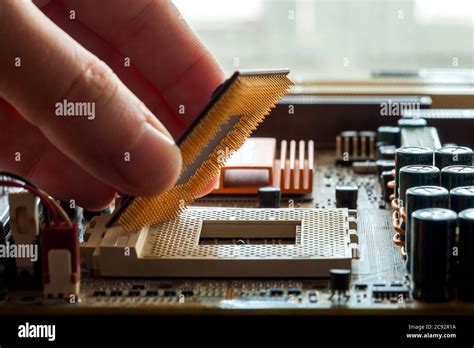 Technician Plug In CPU Microprocessor To Motherboard Socket Evident Process Of Installation