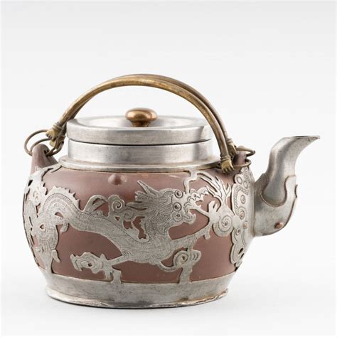 Lot Two Red Clay Yi Xing Pottery Teapots One Mounted In Pewter With Dragons Tallest 4 1 2 In