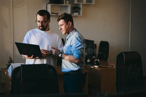 Portrait Of Two Professional Male Programmers Working On Computer In Diverse Offices Modern It