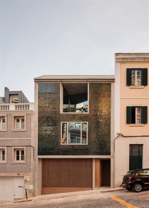 Bak Gordon Inserts Green Tiled Concrete House On Sloping Street In Lisbon