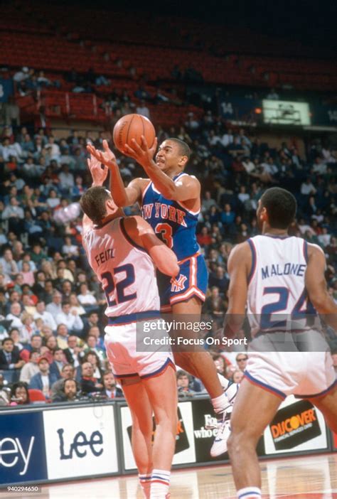 Mark Jackson Of The New York Knicks Shoots Over Dave Feitl Of The