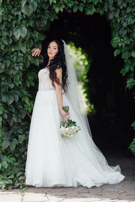 Beautiful With A Large Bust The Bride In A Wedding Dress Poses For