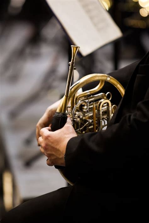 French Horn In The Hands Of A Musician In The Orchestra Stock Image