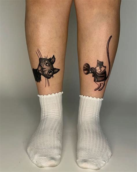 Two People With Tattoos On Their Legs One Has A Mouse And The Other