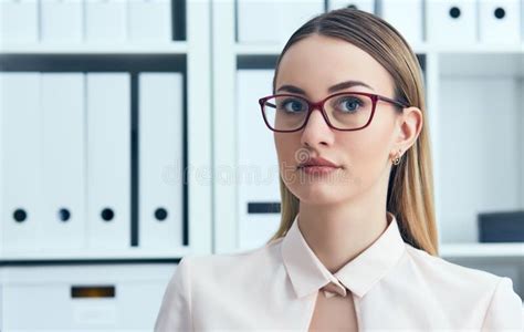 Portrait Of Caucasian Attractive Business Woman In Glasses At Office