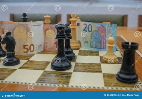 Banknotes On The Chessboard Among The Pieces Stock Photo Image Of