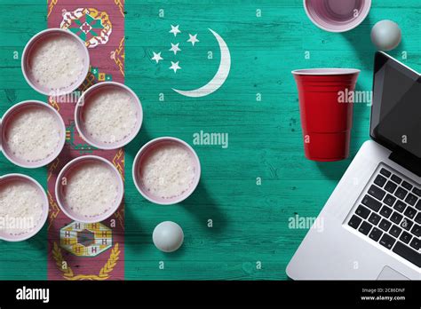 Turkmenistan Flag Concept With Plastic Beer Pong Cups And Laptop On