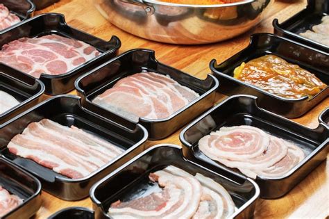 Premium Photo Set Of Shabu Shabu In Hot Pot Fresh Sliced Meat Sea