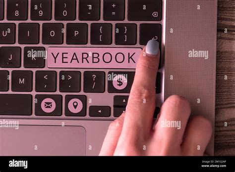 Sign Displaying Yearbook Word For Publication Compiled By Graduating