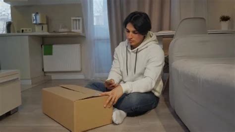 Man Scanning QR Code On The Box For Read Stock Video Pond