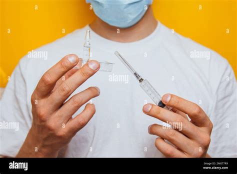Researcher Or Scientist Holding A Flu Syringe With A Vaccine Isolated