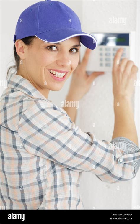 Woman Set The Thermostat At House Stock Photo Alamy