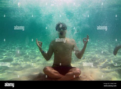 Young Man Underwater On Holidays At The Beach Zen Position Underwater Man Relaxing Underwater