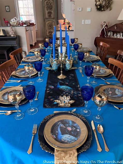 A Beautiful Peacock Themed Table Setting For The Holidays