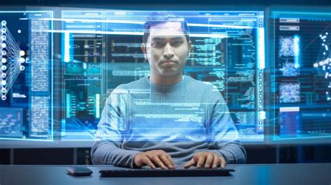 Portrait Of Software Developer Hacker Wearing Glasses Sitting At His