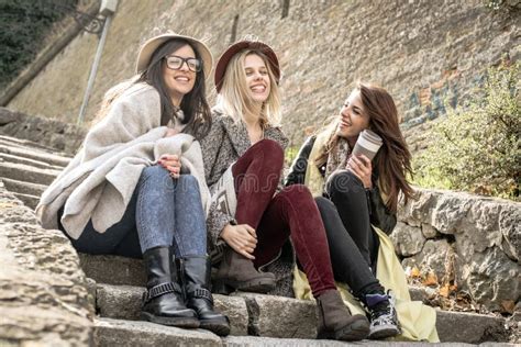 Three Young Girls Sitting On The Stairs At The Public Park Stock Image Image Of Enjoyment