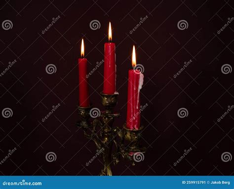 Burning Red Candles In A Candlestick Lighted Candles In An Old