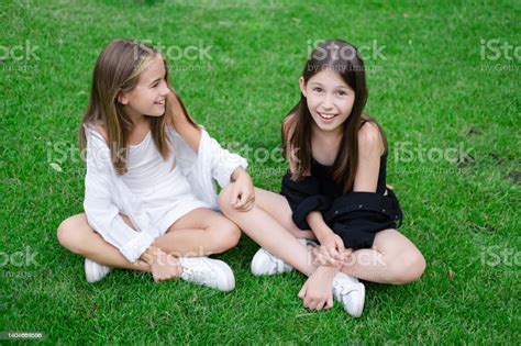 Fraternal Twins Sisters Blonde And Brunette Teen Girls In Fashionable