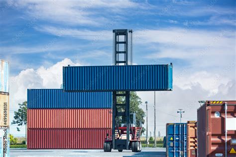 Crane Lifting Up Container In Railroad Yard Crane Lifting Up Container In Yard Forklift