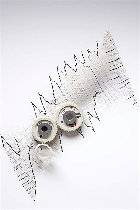 Paper Shaped Gears On Top Of An Ecg Chart Background Wallpaper Image