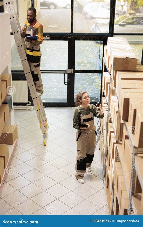Stockroom Employee Scanning Boxes Using Store Scanner Stock Image