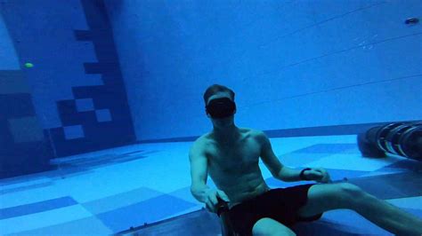Blonde Freediver Breatholding Deep Underwater
