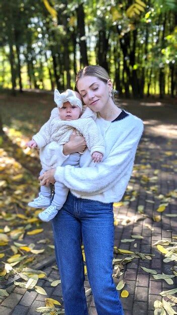 Premium Photo Happy Mother Holds Her Little Daughter In Her Arms