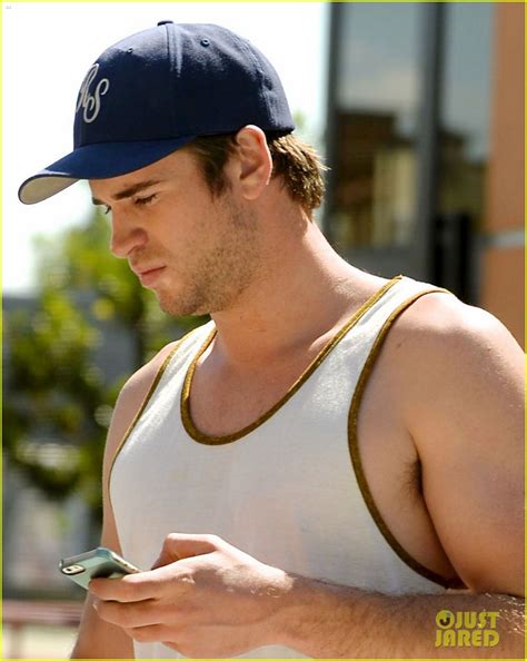 Liam Hemsworth Puts His Buff Biceps On Display In A Tank Top Photo