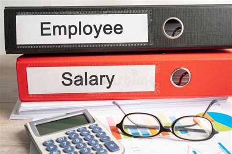 Payroll Overtime Binder Data Finance Report Business With Graph Analysis In Office Stock Image