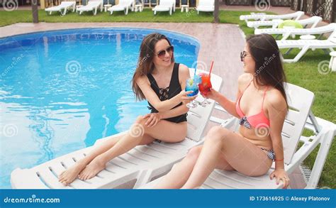 Best Girlfriends On Vacation Drinking Cocktails Lying On Loungers By