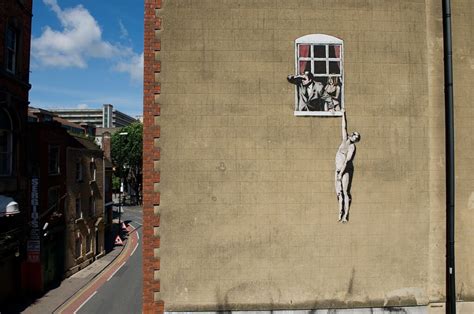 Naked Man Hanging From Window 2006 Banksy Explained