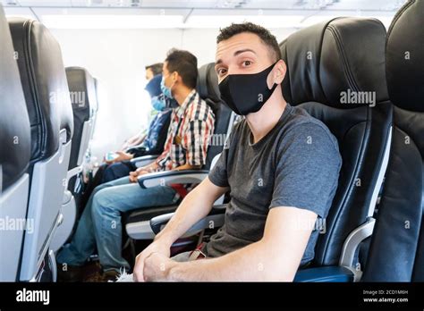 Airplane Passengers Are Wearing Medical Masks On Their Faces Air