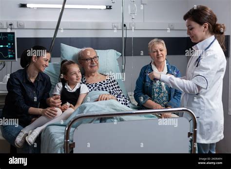 Elderly Bedridden Man Relatives Happily Attending Care Prevention