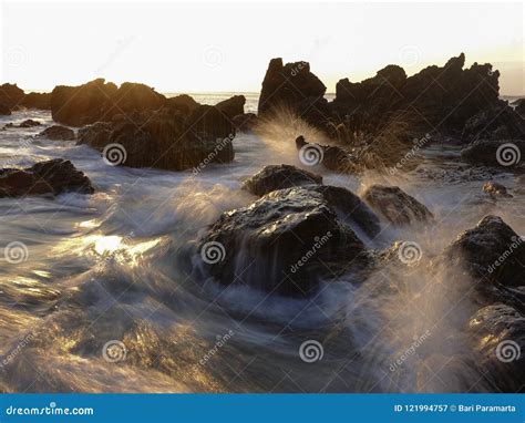 Waves Crashing Rocks On Beach At Sunset Sunrise Stock Image Image Of