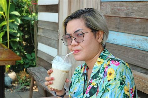 Premium Photo Young Woman Drinking Glass