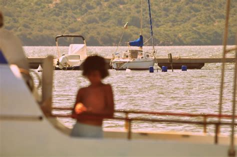 Premium Photo Shirtless Boy Standing On Boat Sailing At Sea