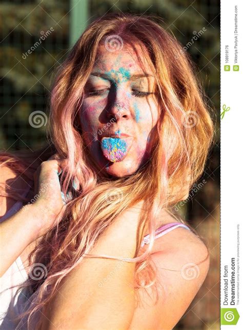 Closeup Shot Of Pretty Young Model Covered With Colorful Holi Pa Stock