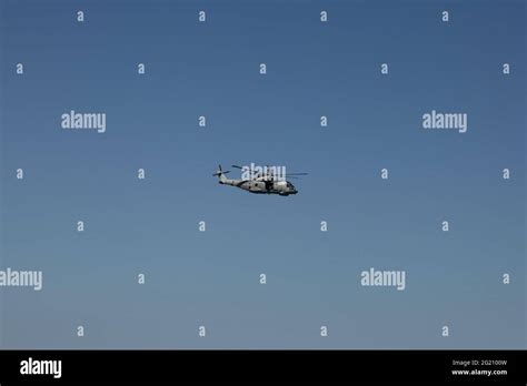 Royal Navy Merlin Helicopter Against Blue Sky Flying During G7 Summit