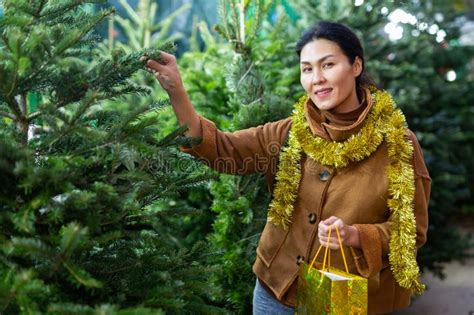Woman Customer Buying Fir Tree At Christmas Market Stock Image Image