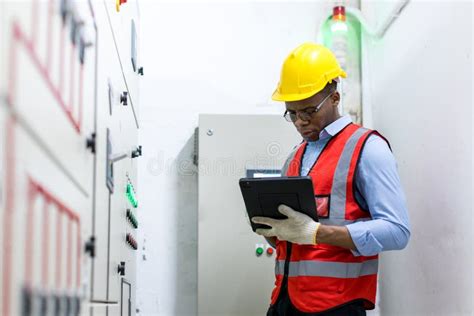 Electrical Engineer Working In Control Room Electrical Engineer Man Checking Power Distribution