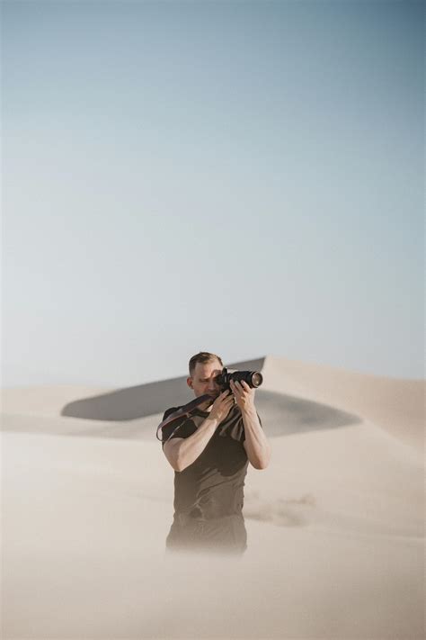 Create An Image Of A Guy Digging Sand In Desert Photos Download The Best Free Create An Image