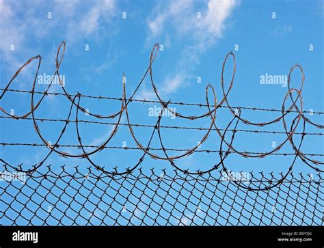 Chain Link Fence With Barbed And Razor Wire Stock Photo Alamy
