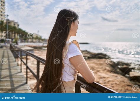 Young Chinese Girl Smiling Happy Standing At The Beach Stock Image