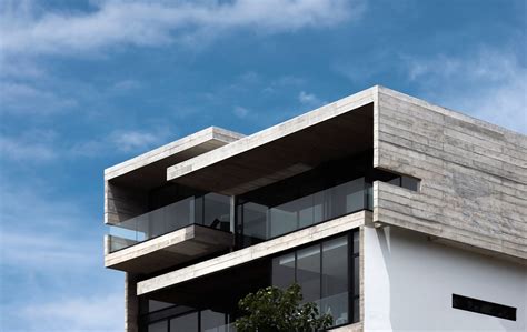 Concrete House By Paz Arquitectura Sits Against A Hill In Guatemala