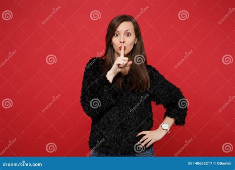 Beautiful Young Woman In Black Fur Sweater Saying Hush Be Quiet With